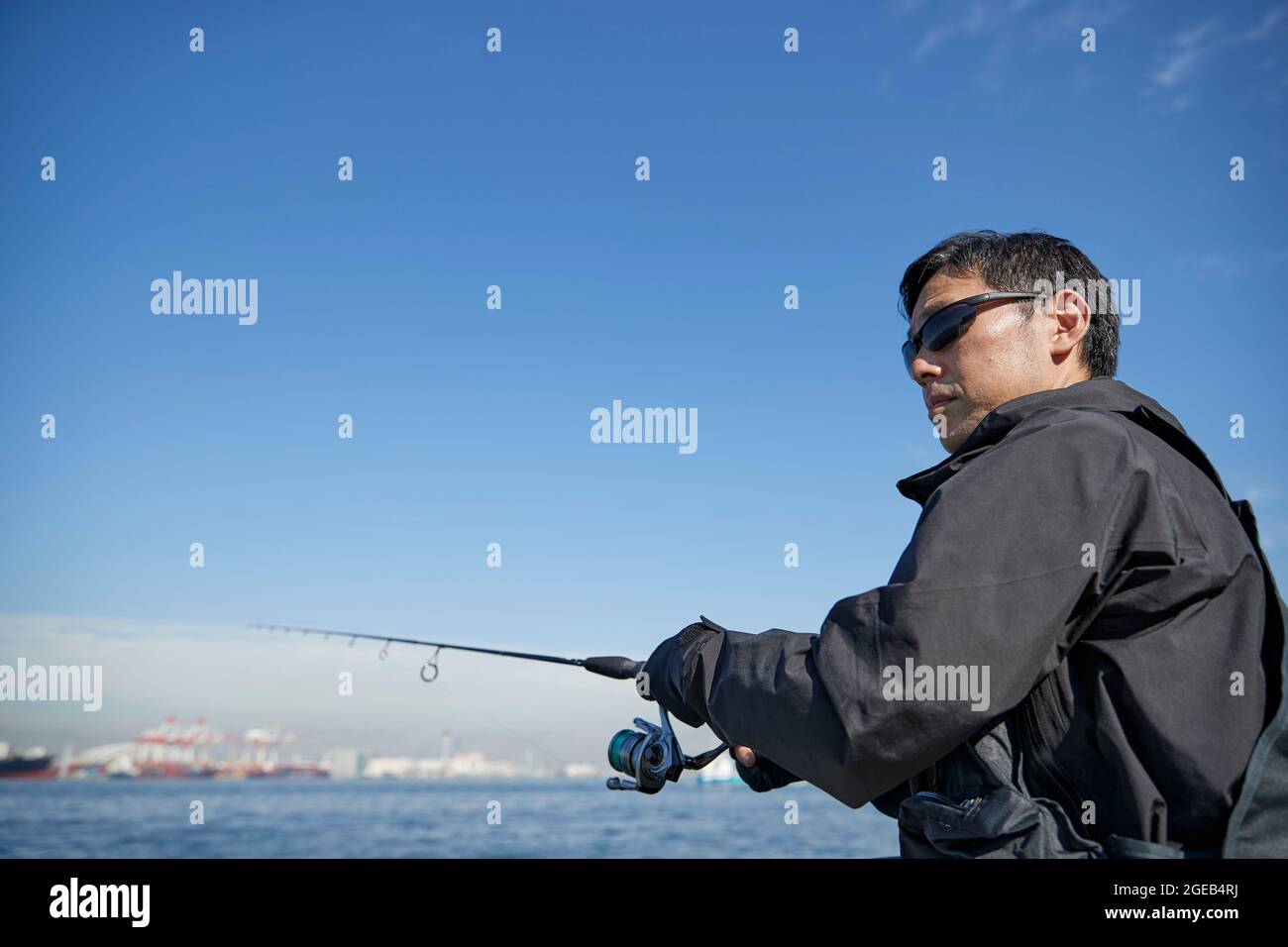 Japanese man fishing Stock Photo - Alamy