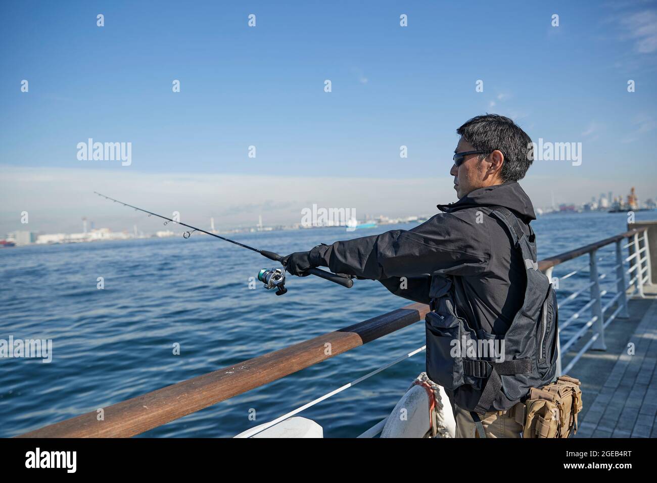 Japanese man fishing Stock Photo - Alamy