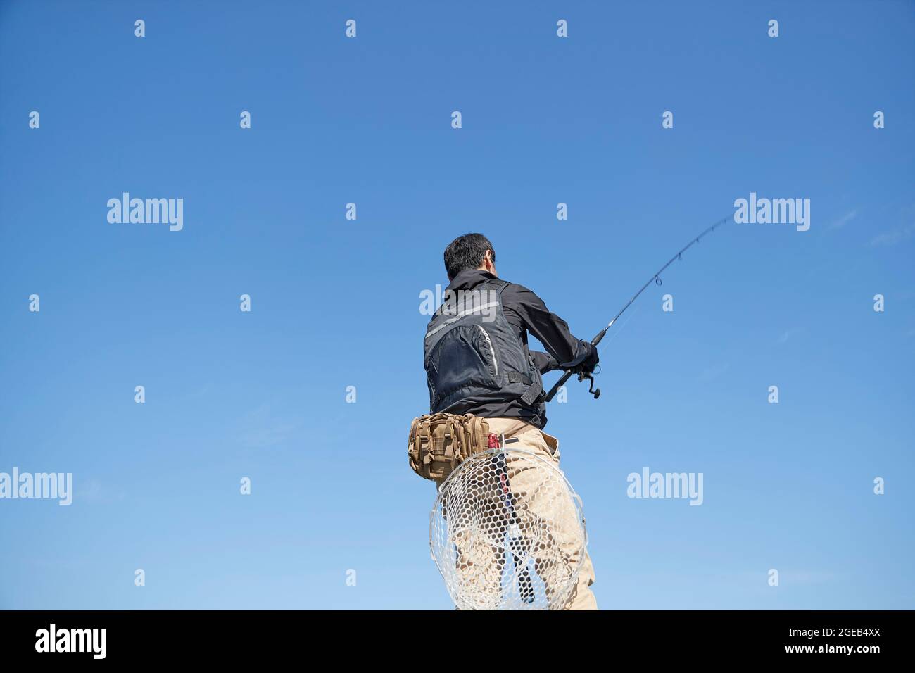 Japanese man fishing Stock Photo - Alamy