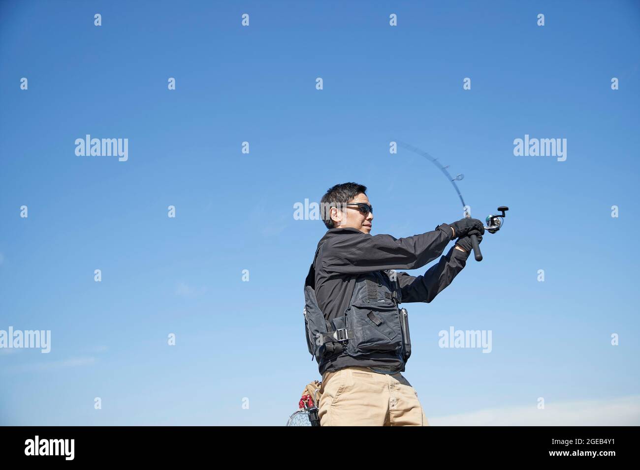 Japanese man fishing Stock Photo - Alamy