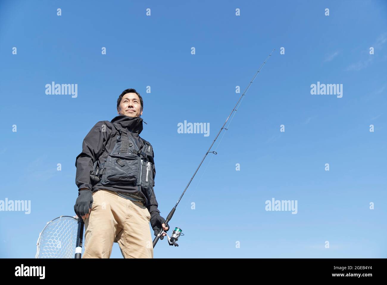 Japanese man fishing Stock Photo - Alamy