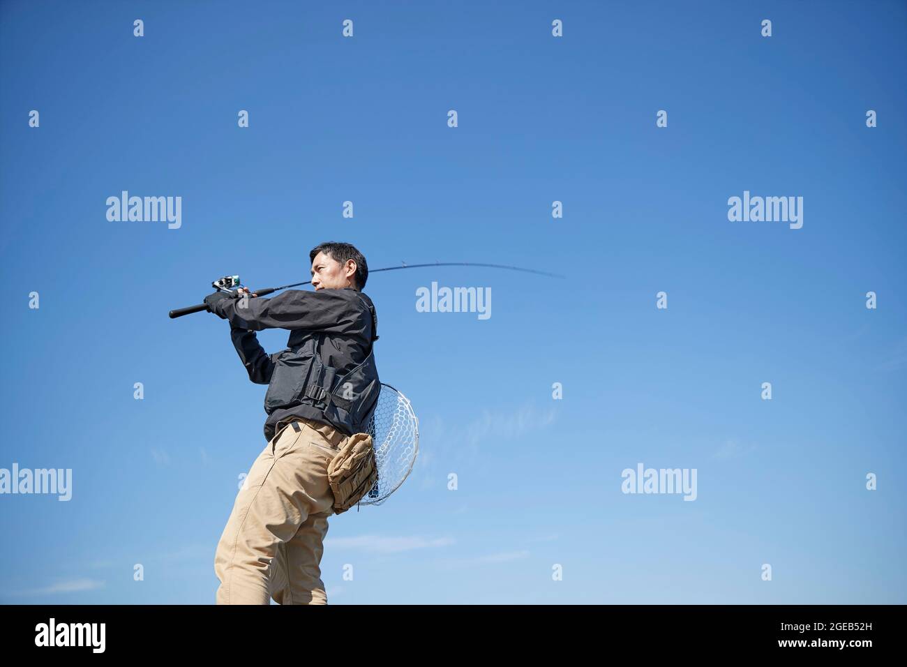 Japanese man fishing Stock Photo - Alamy
