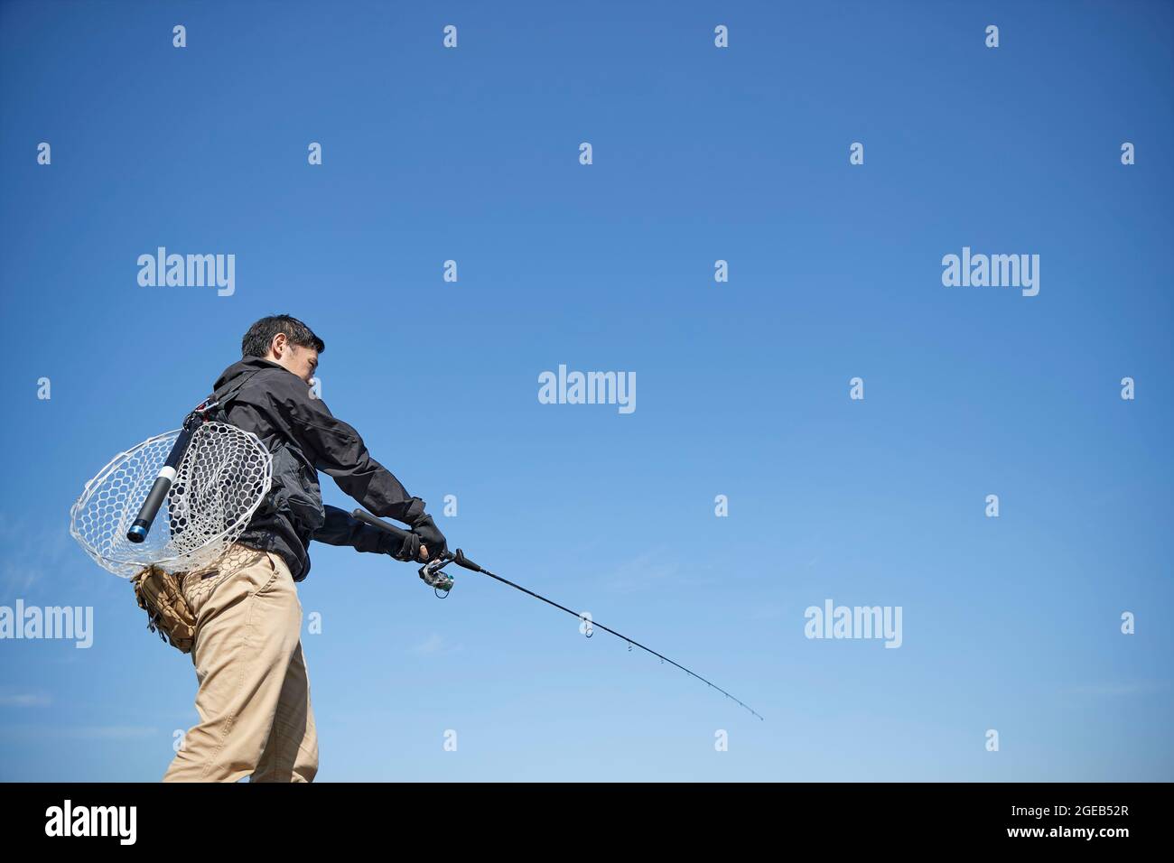 Japanese man fishing Stock Photo - Alamy