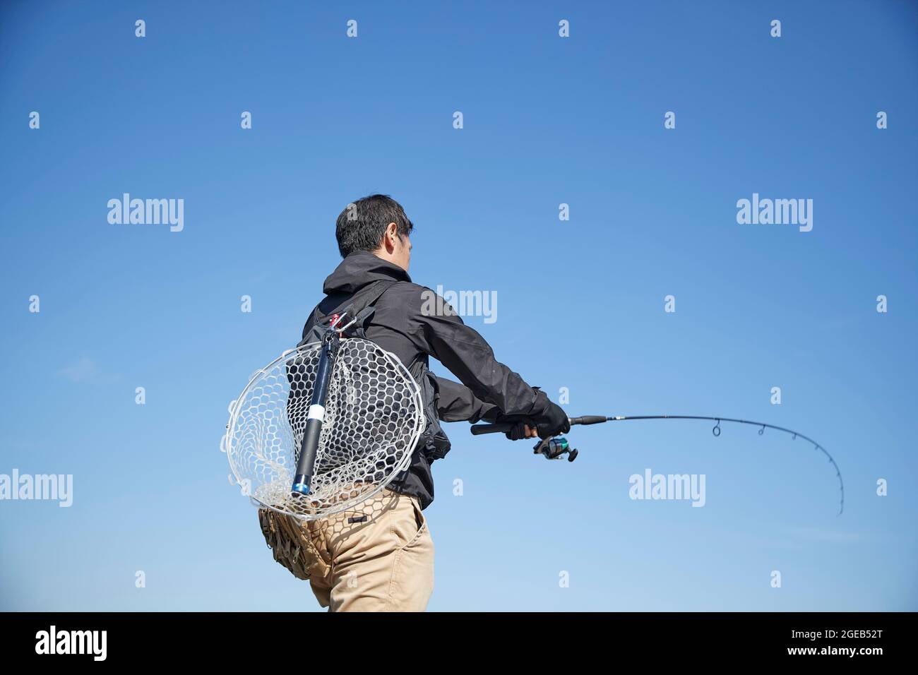 Japanese man fishing Stock Photo - Alamy