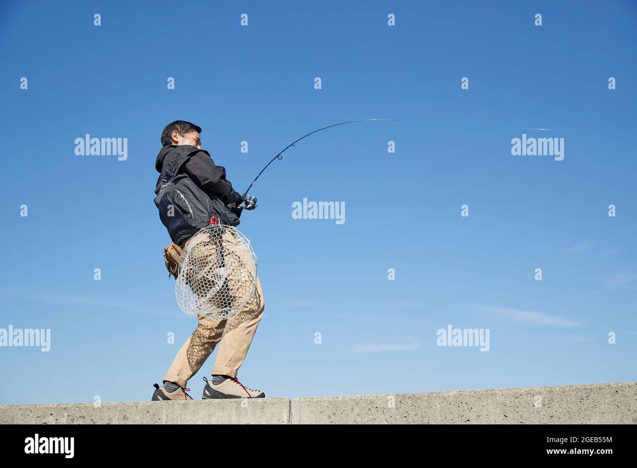 Japanese man fishing Stock Photo - Alamy