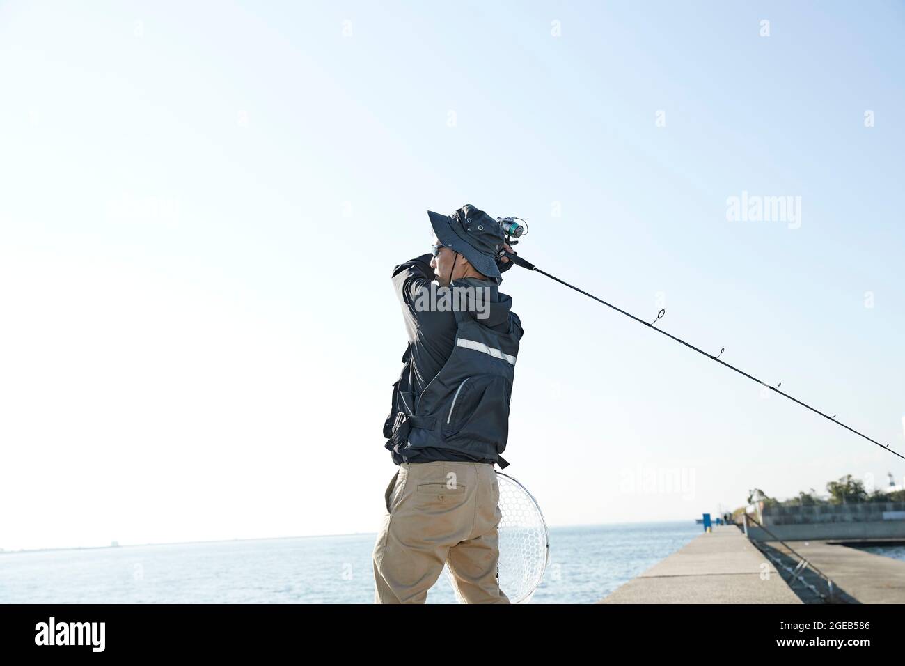 Japanese man fishing Stock Photo - Alamy
