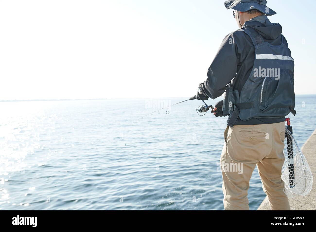 Japanese man fishing Stock Photo - Alamy