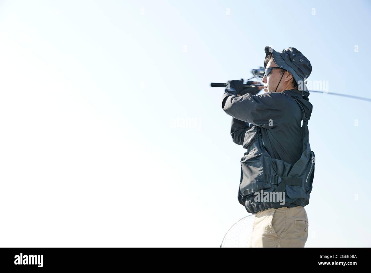 Japanese man fishing Stock Photo - Alamy