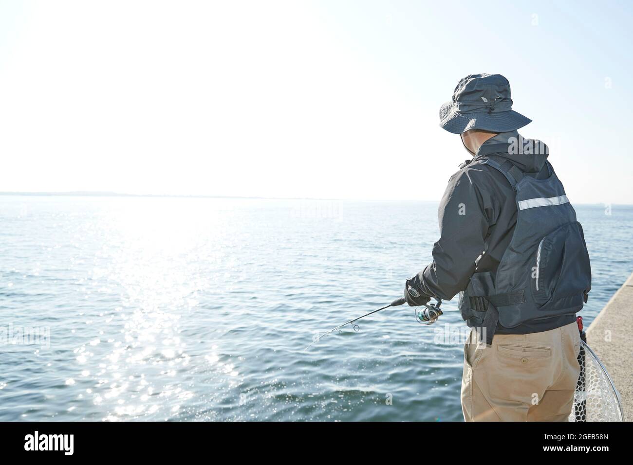 Japanese man fishing Stock Photo - Alamy