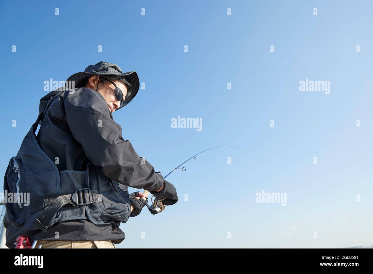 Japanese man fishing Stock Photo - Alamy