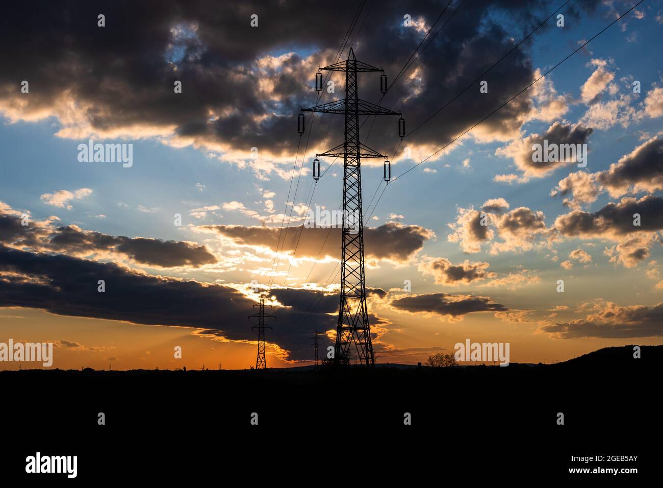 Beautiful dramatic sky and clouds, sunset lights over the transmission ...