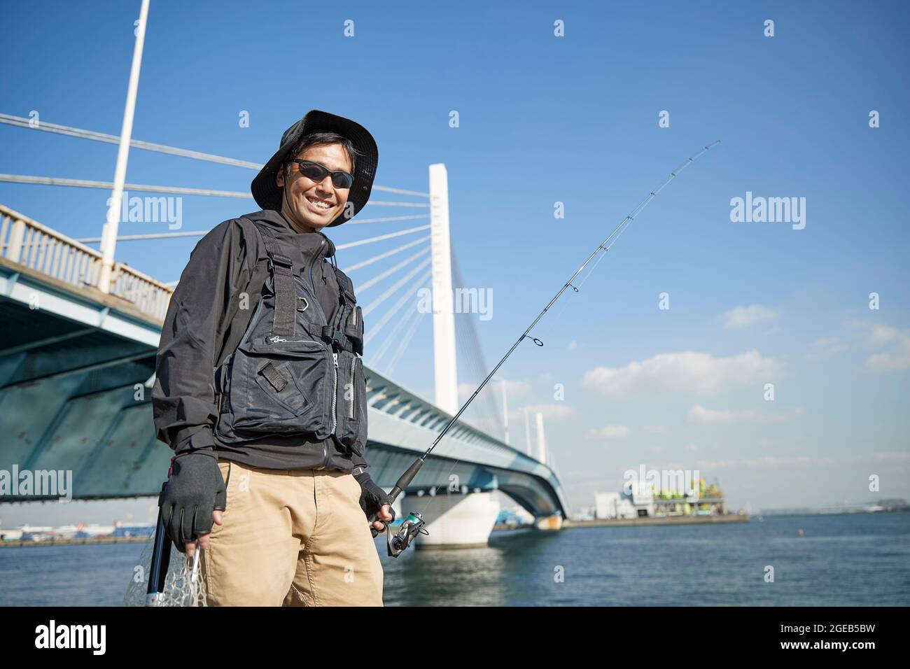 Japanese man fishing Stock Photo - Alamy