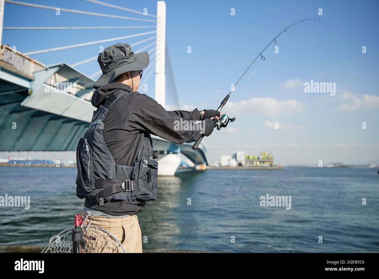 Japanese man fishing Stock Photo - Alamy