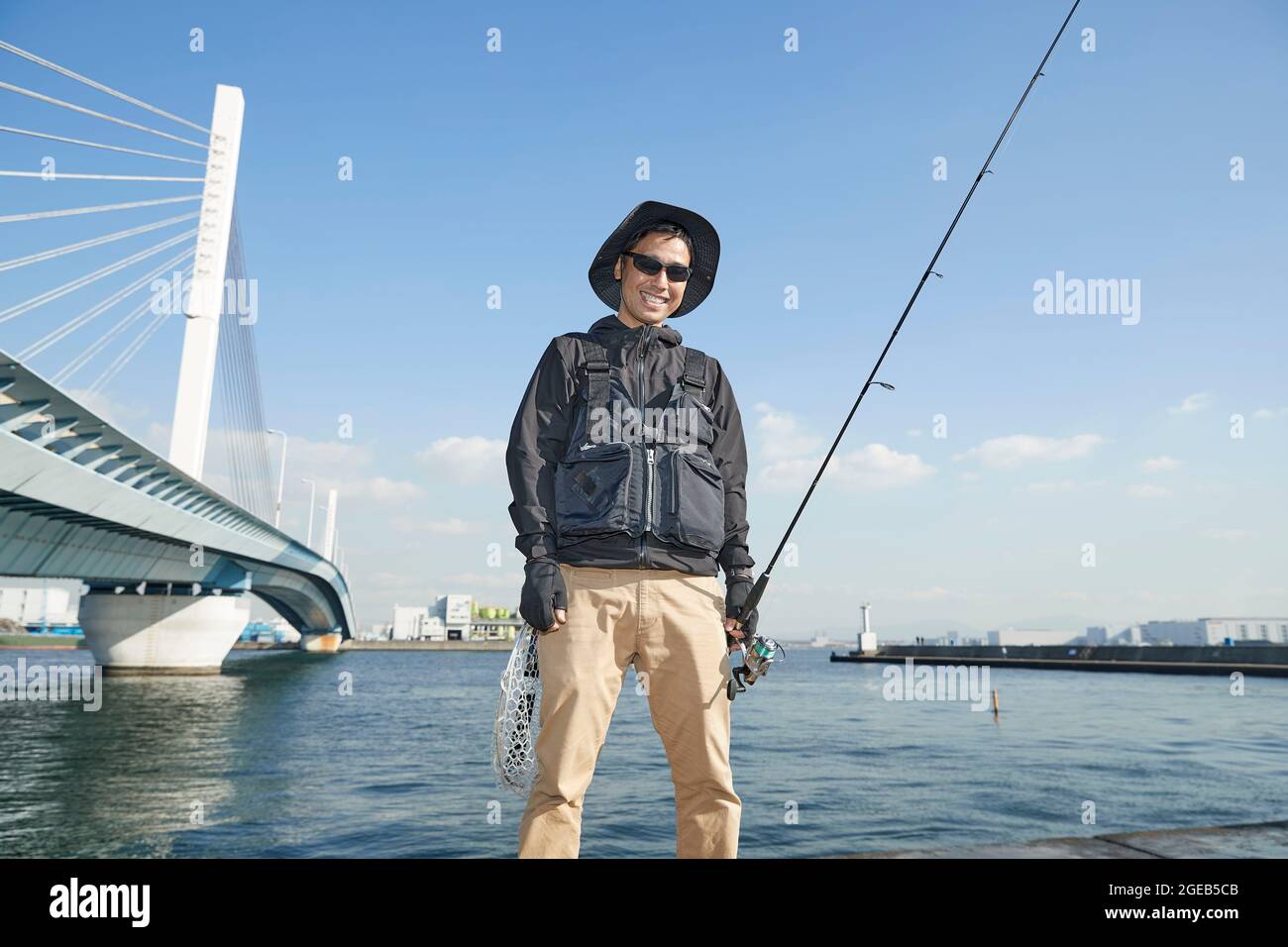 Japanese man fishing Stock Photo - Alamy