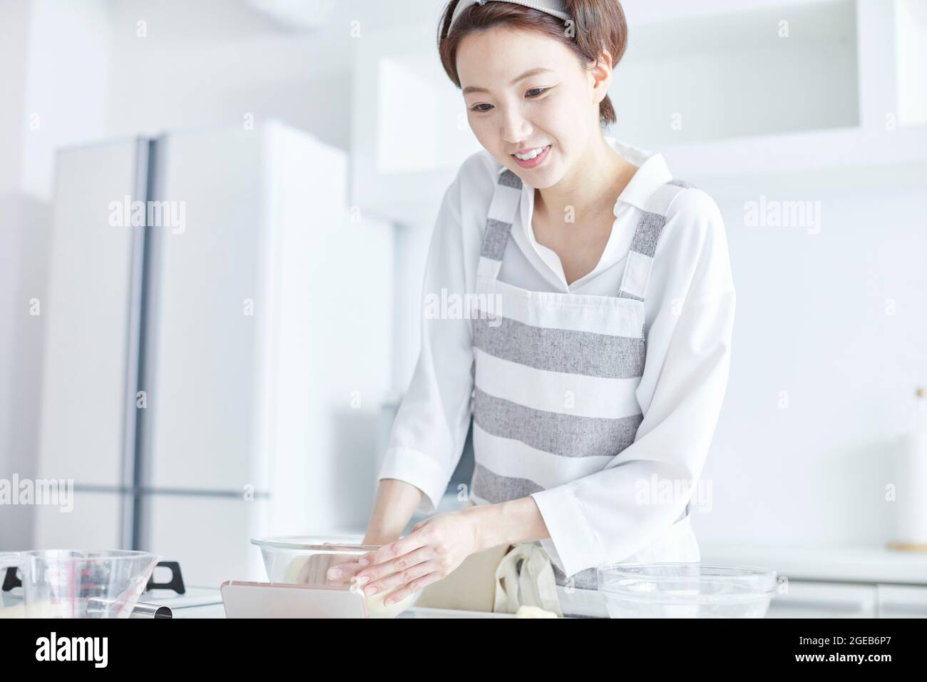 Japanese woman cooking at home Stock Photo - Alamy