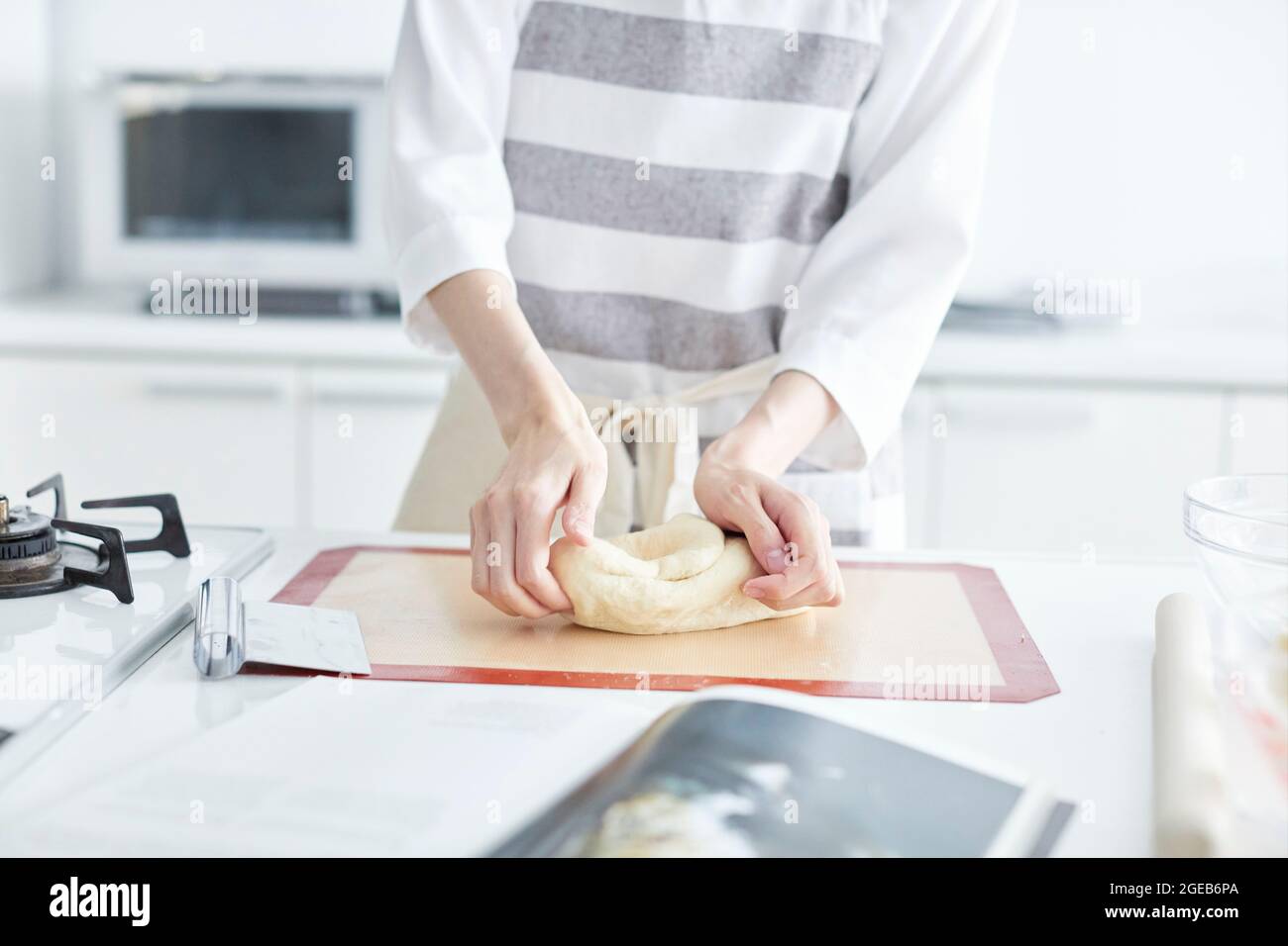 Japanese woman cooking at home Stock Photo - Alamy