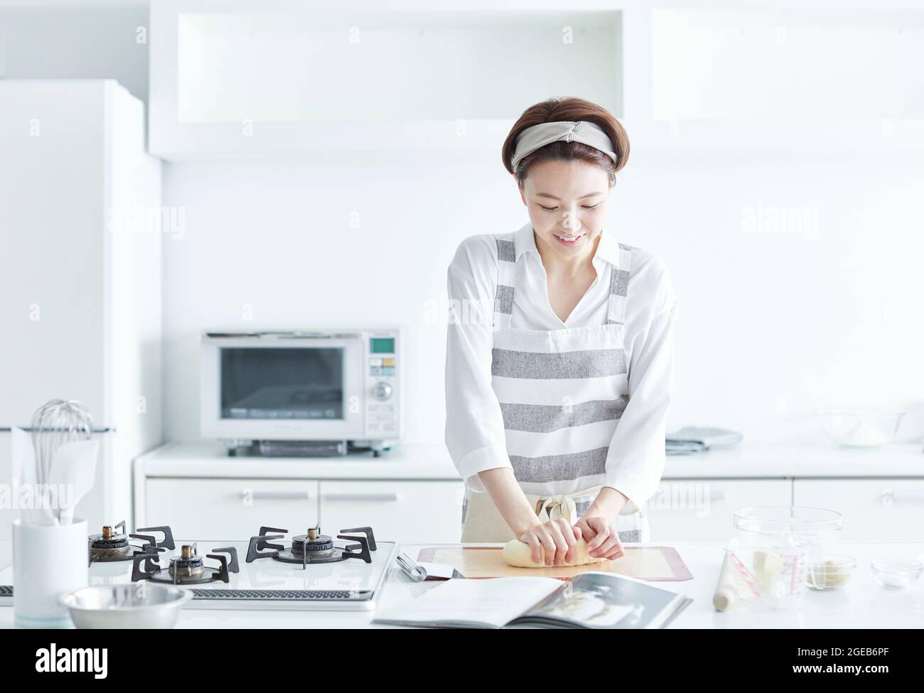 Japanese woman cooking at home Stock Photo - Alamy