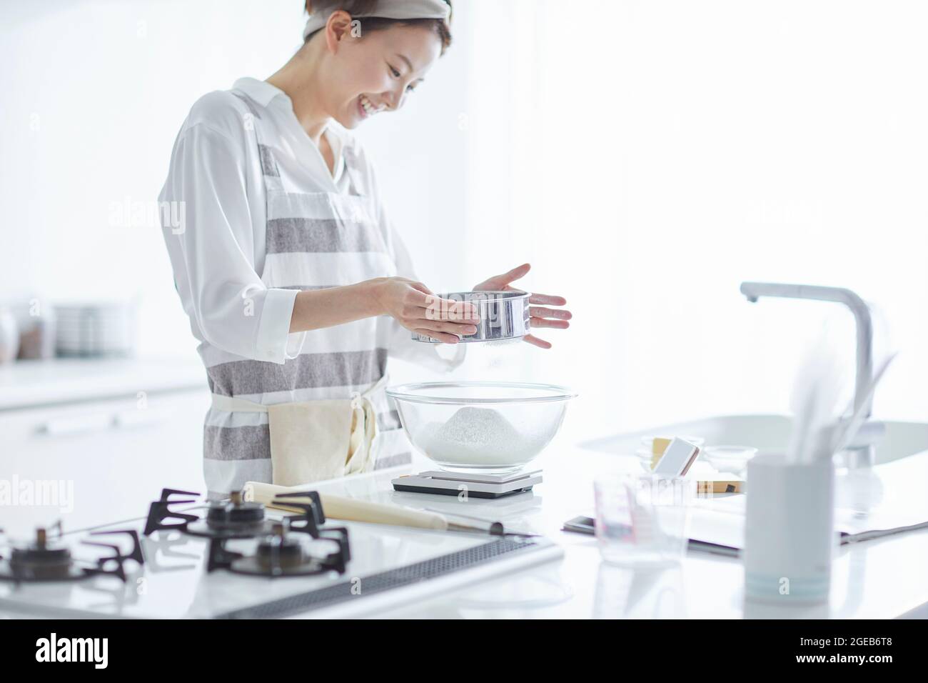 Japanese woman cooking at home Stock Photo - Alamy