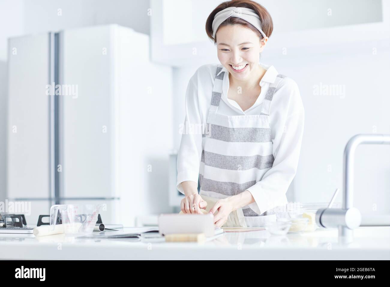 Japanese woman cooking at home Stock Photo - Alamy