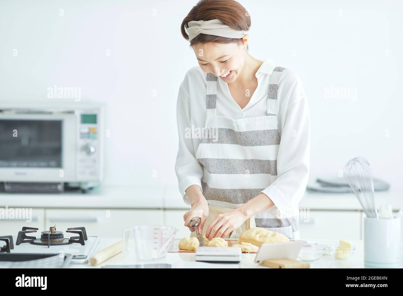 Japanese woman cooking at home Stock Photo - Alamy