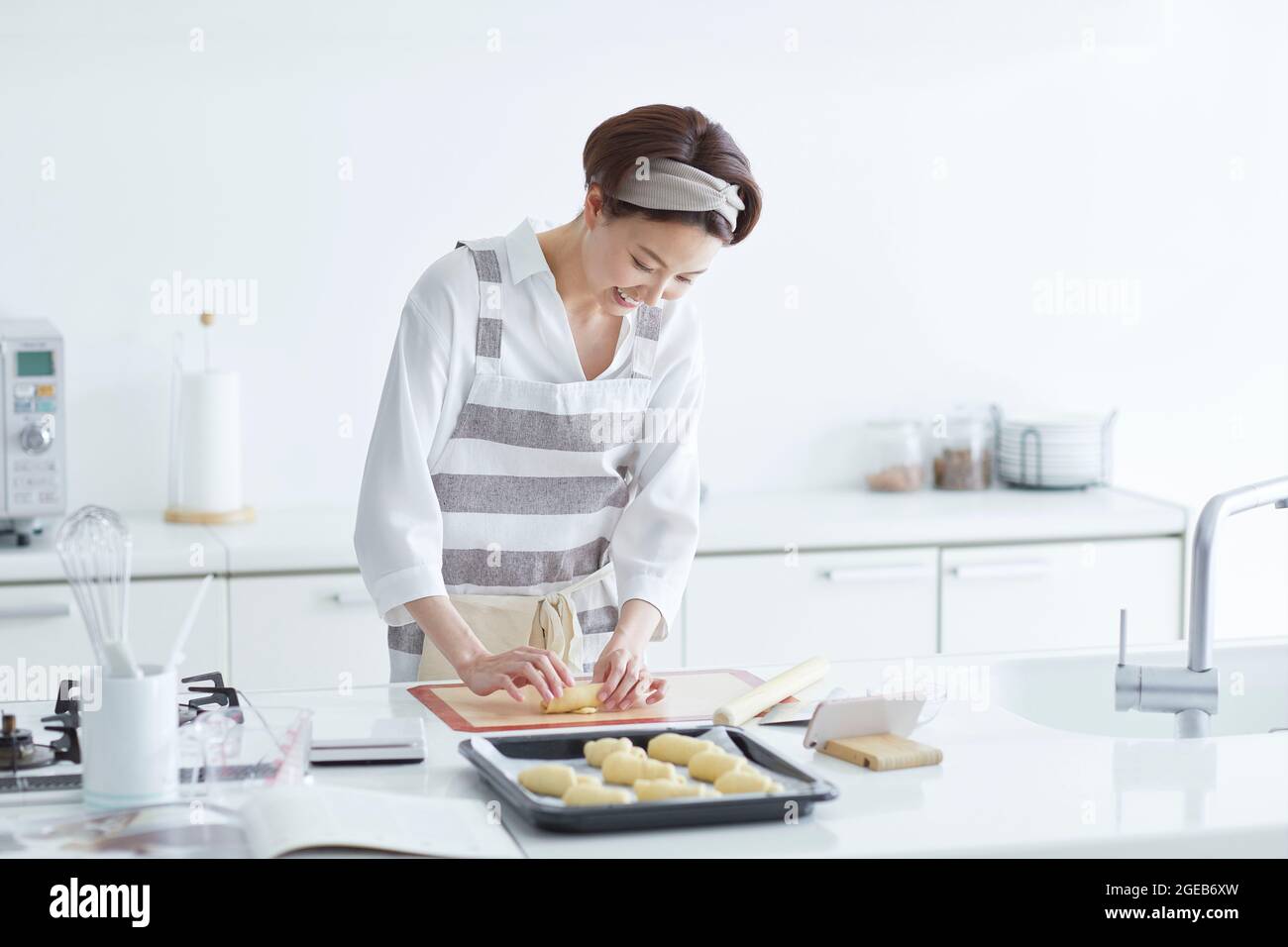Japanese woman cooking at home Stock Photo - Alamy