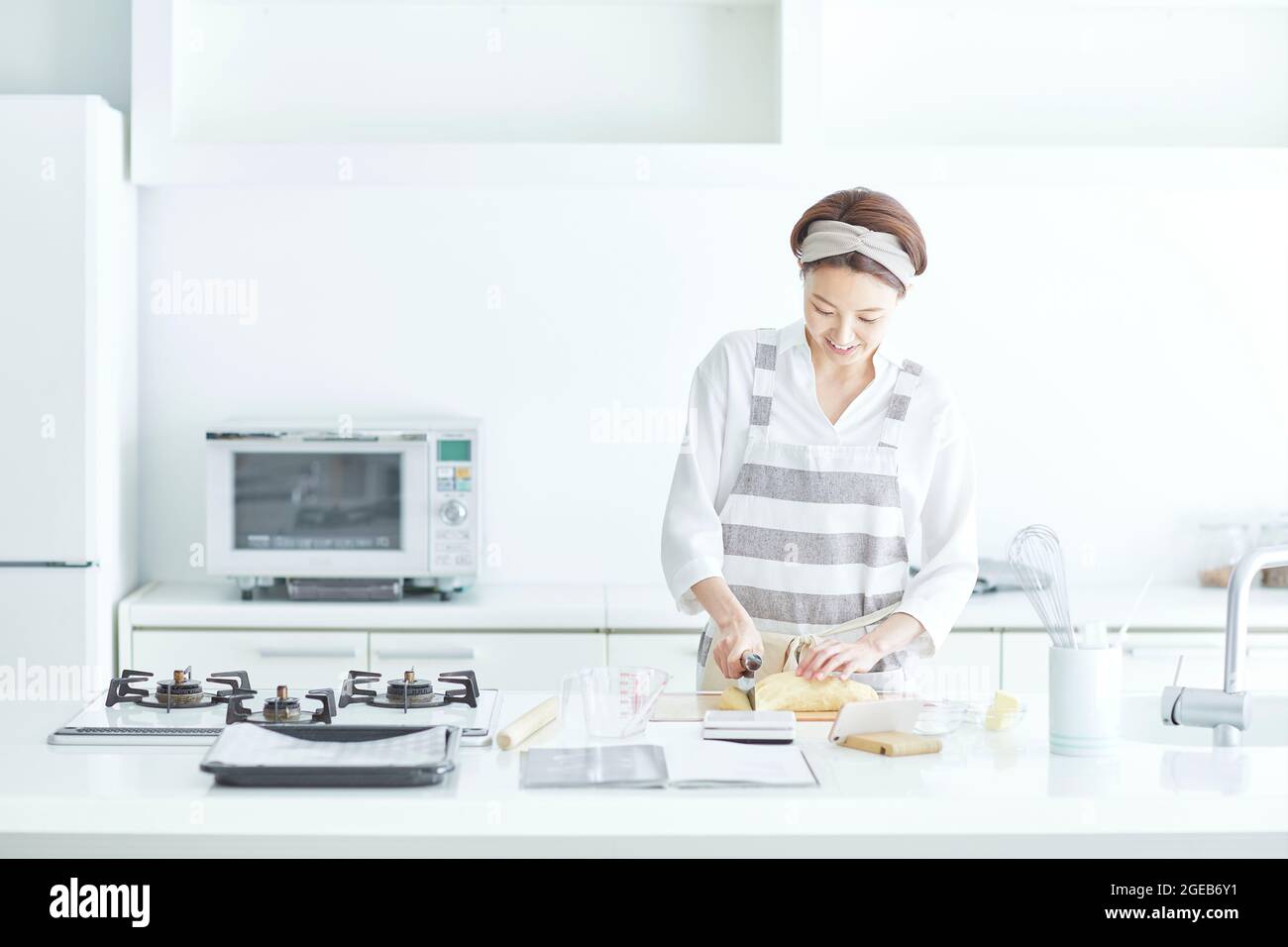 Japanese woman cooking at home Stock Photo - Alamy
