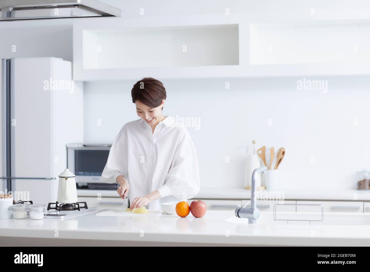 Japanese woman cooking at home Stock Photo - Alamy