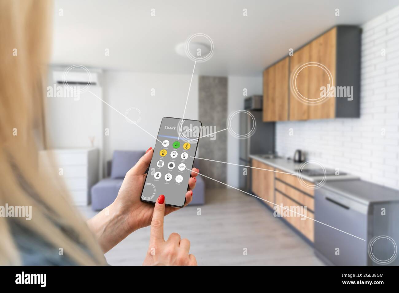 Smart home control on phone. Phone in woman hand. Living room interior ...