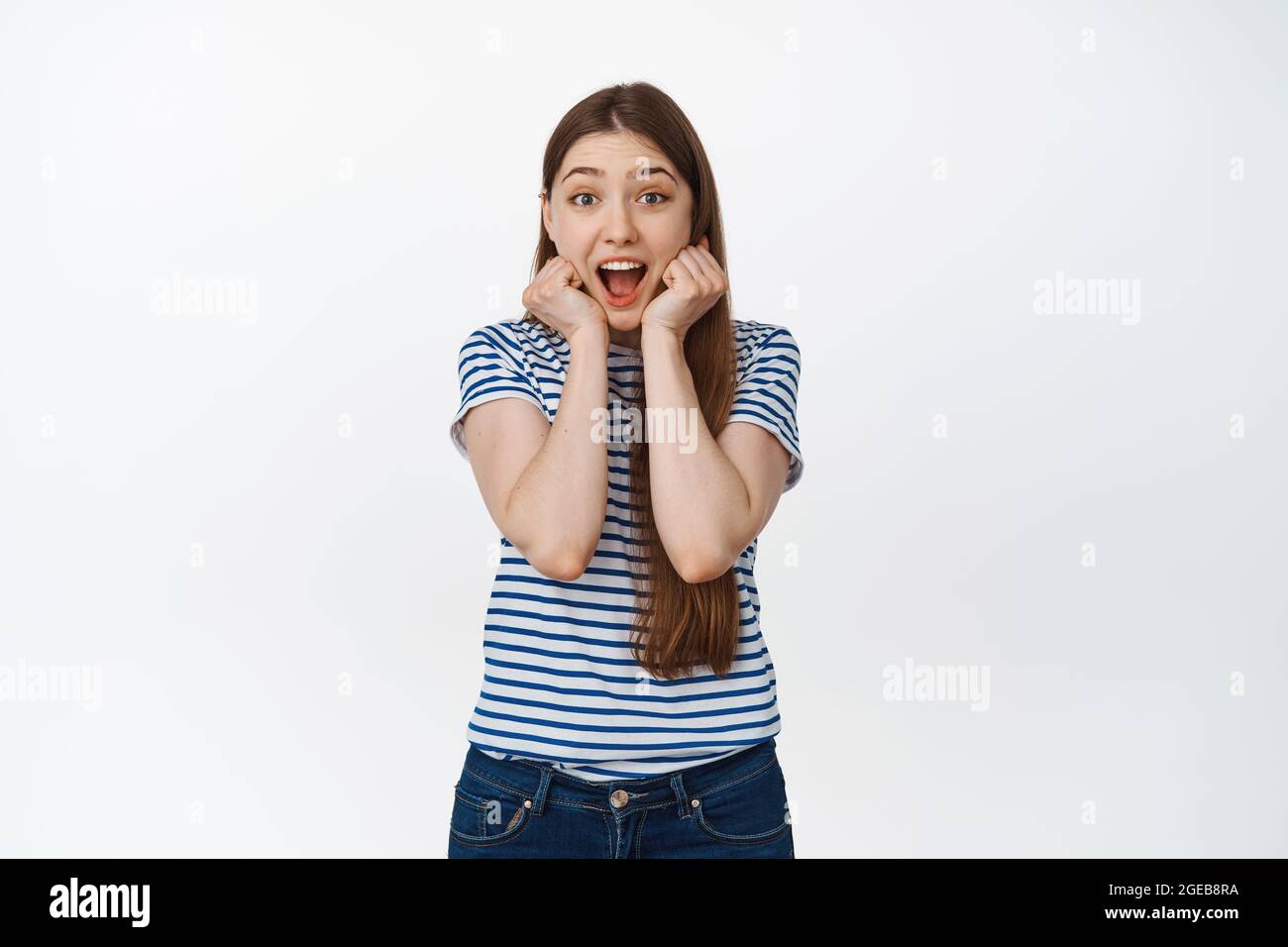 Image of happy, excited woman shouting, screaming from amazement and ...