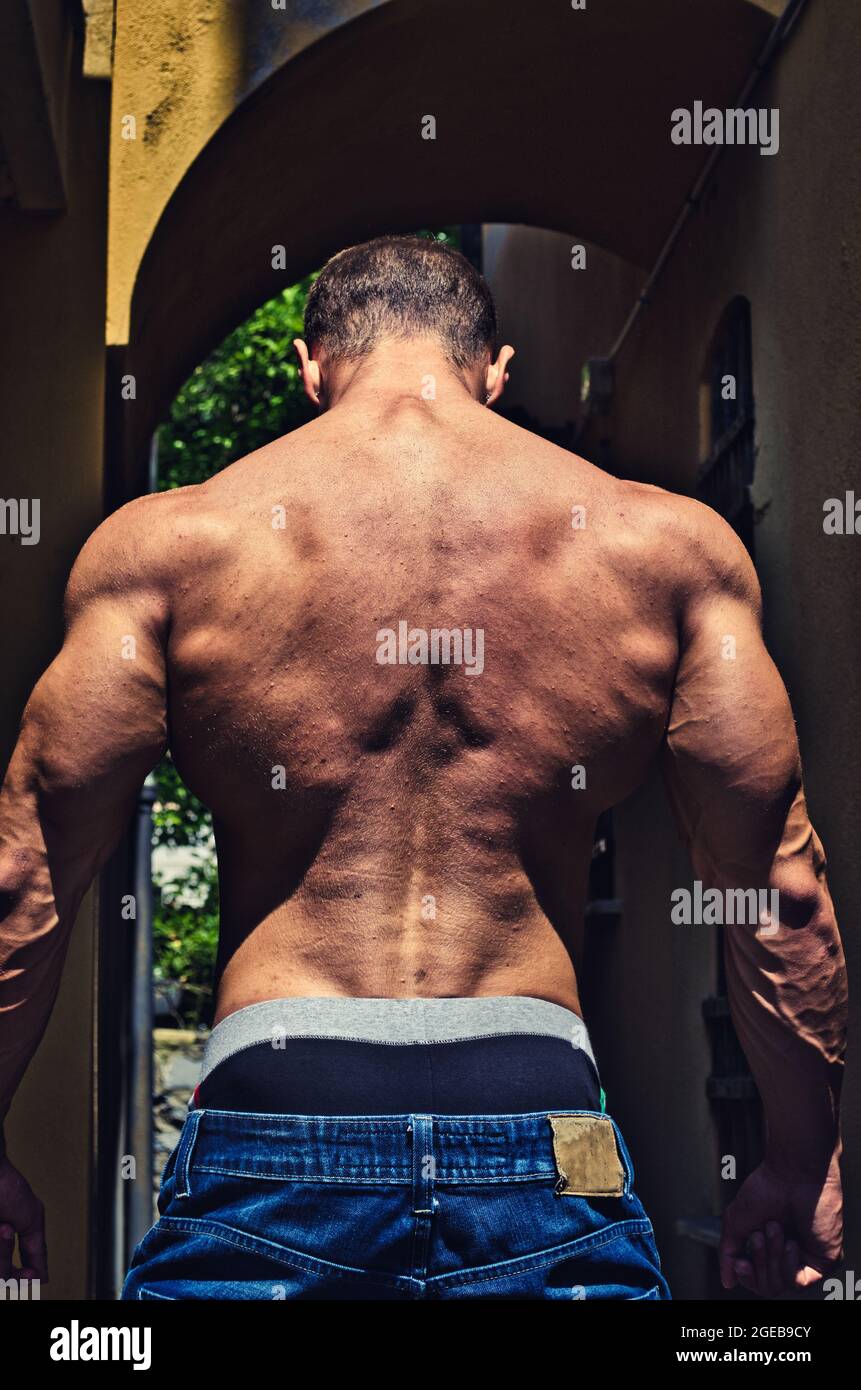 Back of Muscular Shirtless Hunk Man Outdoor in Town Setting Stock Photo ...
