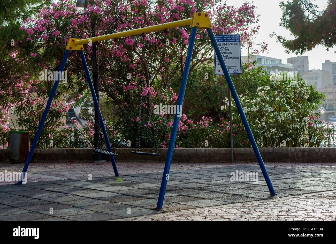 Swing set on playground hi-res stock photography and images - Alamy