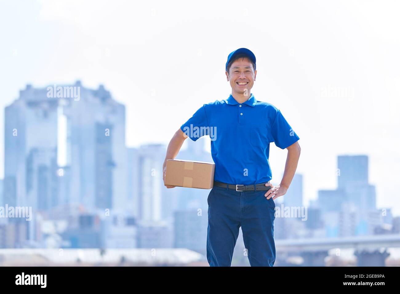 Japanese delivery man outside Stock Photo - Alamy