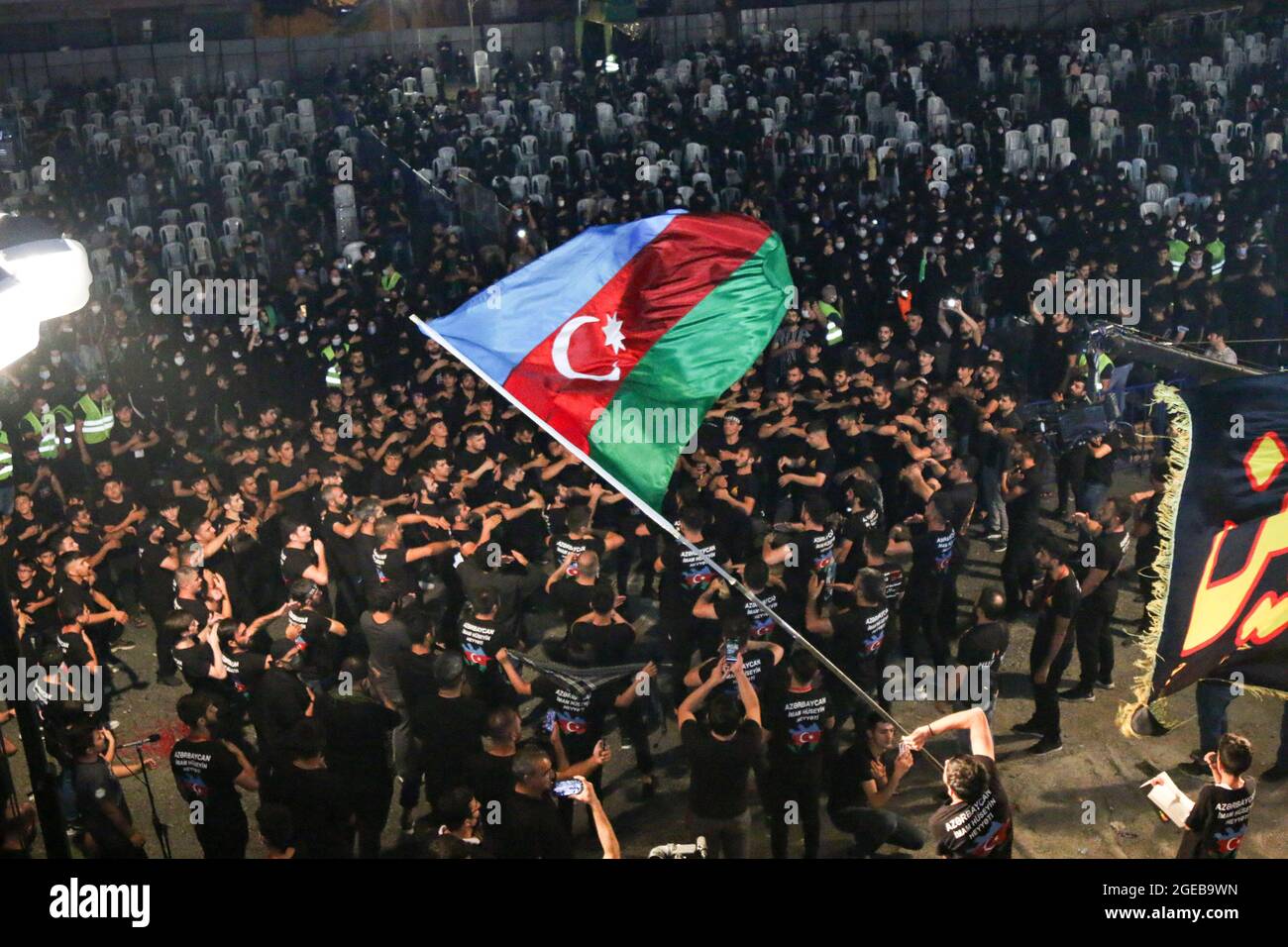 Shiites Muslims participate in a mourning ceremony on the night of ...