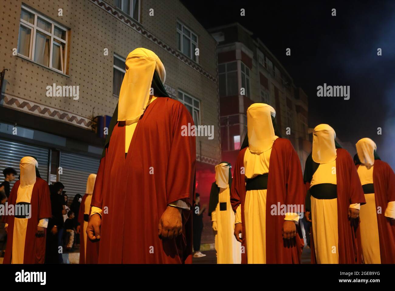 Shiites Muslims attend a mourning ritual on the night of Tasoua, to ...