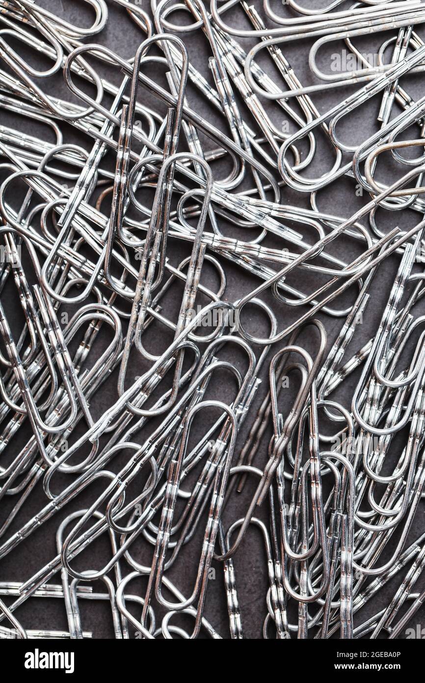 Silver paper clips textured background, full screen Stock Photo - Alamy