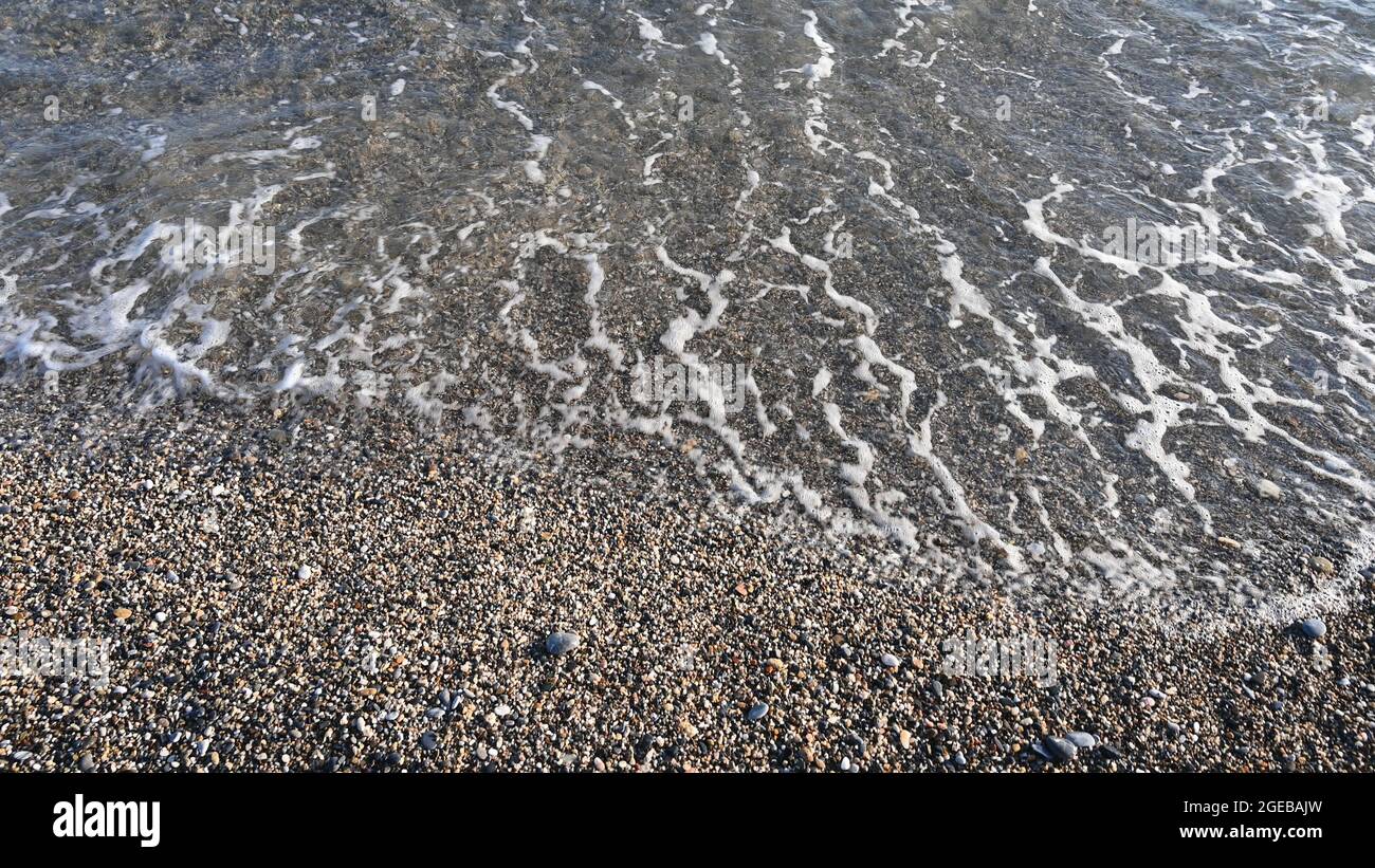 Sea water on the beach, top view Stock Photo - Alamy