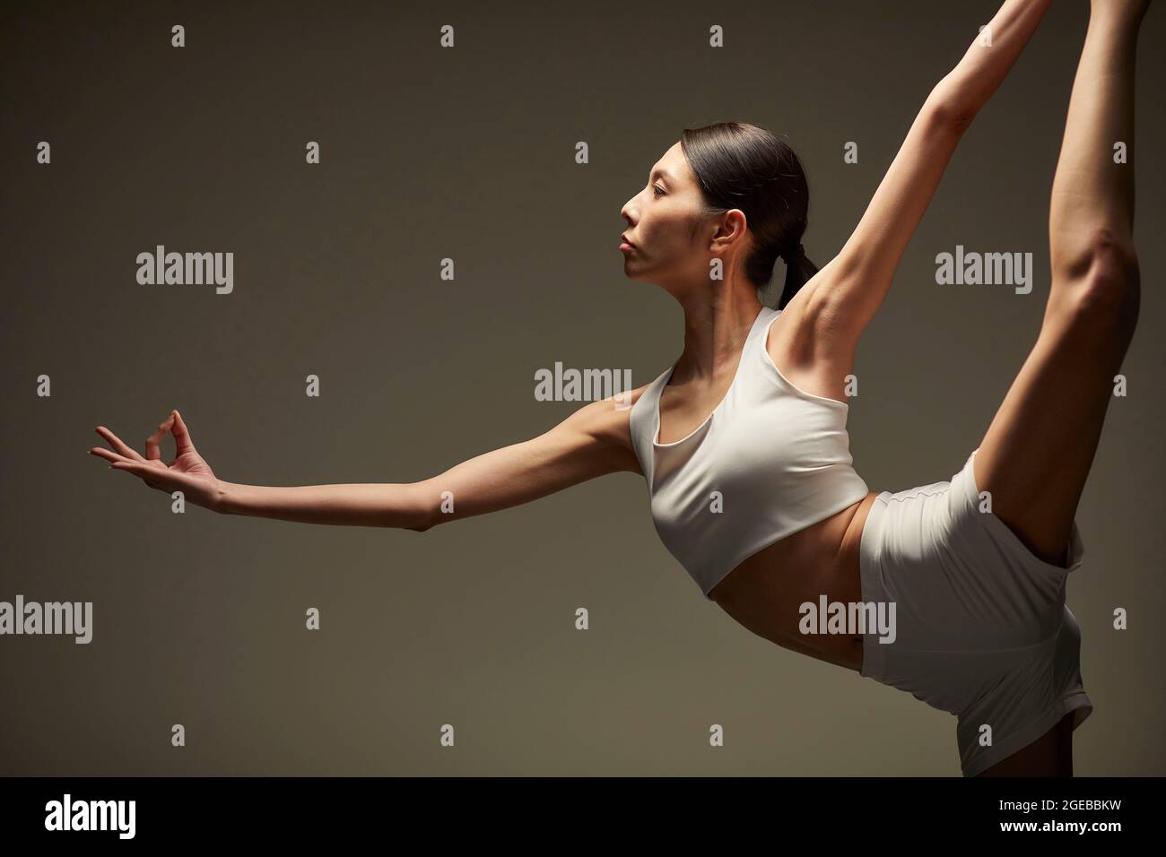Japanese woman practicing yoga Stock Photo - Alamy