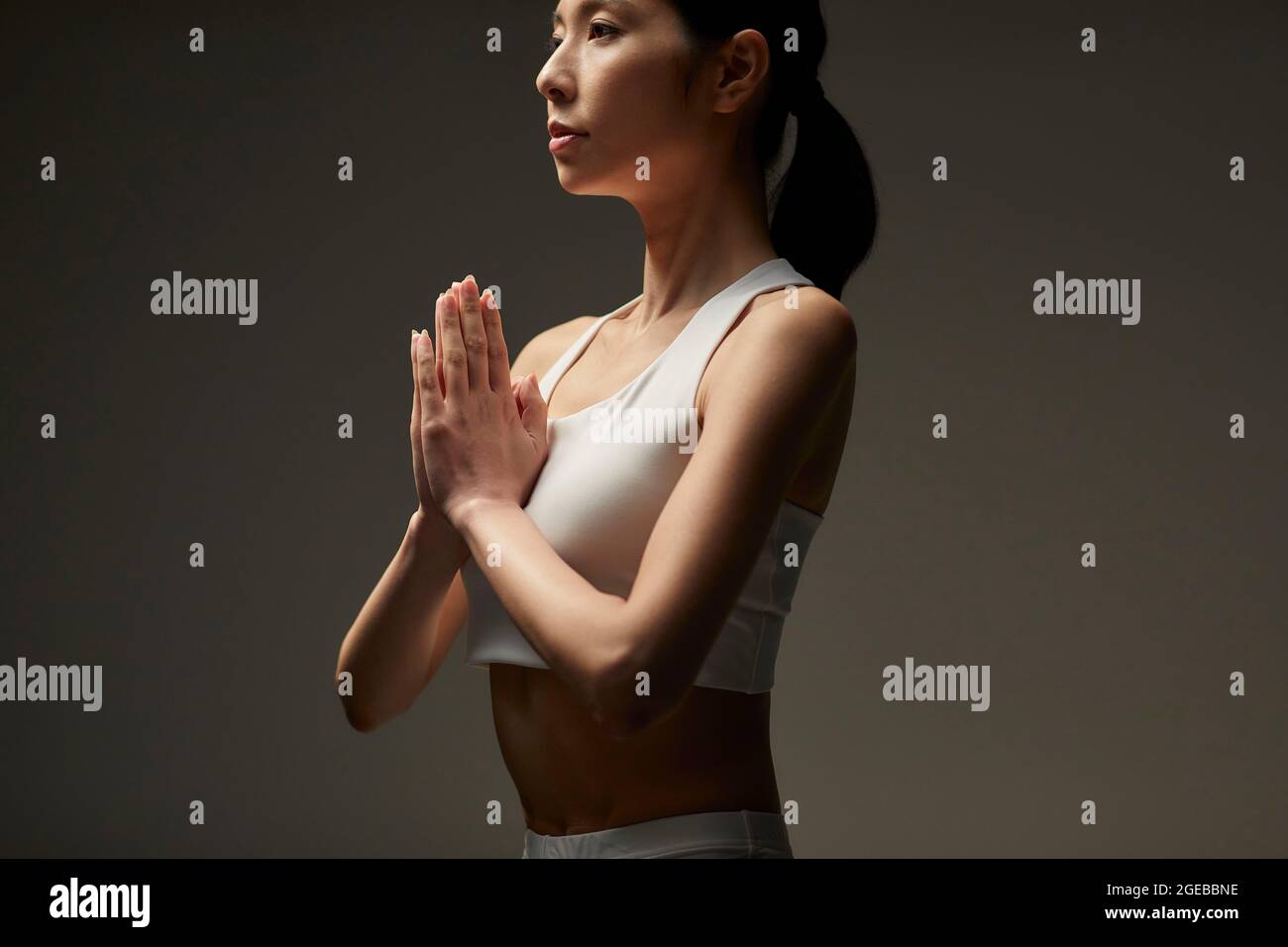 Japanese woman practicing yoga Stock Photo - Alamy