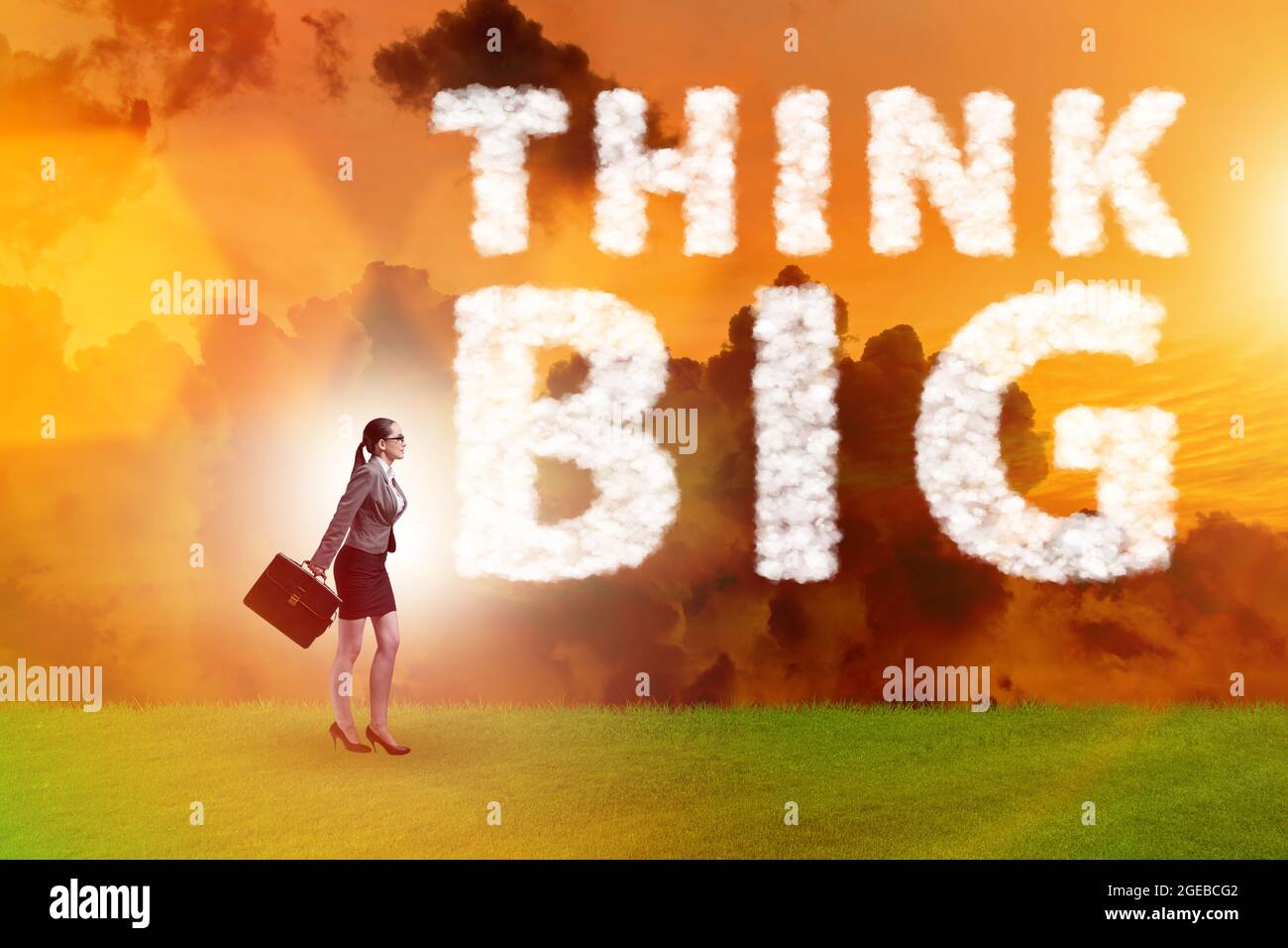 Think big concept with the businesswoman Stock Photo - Alamy