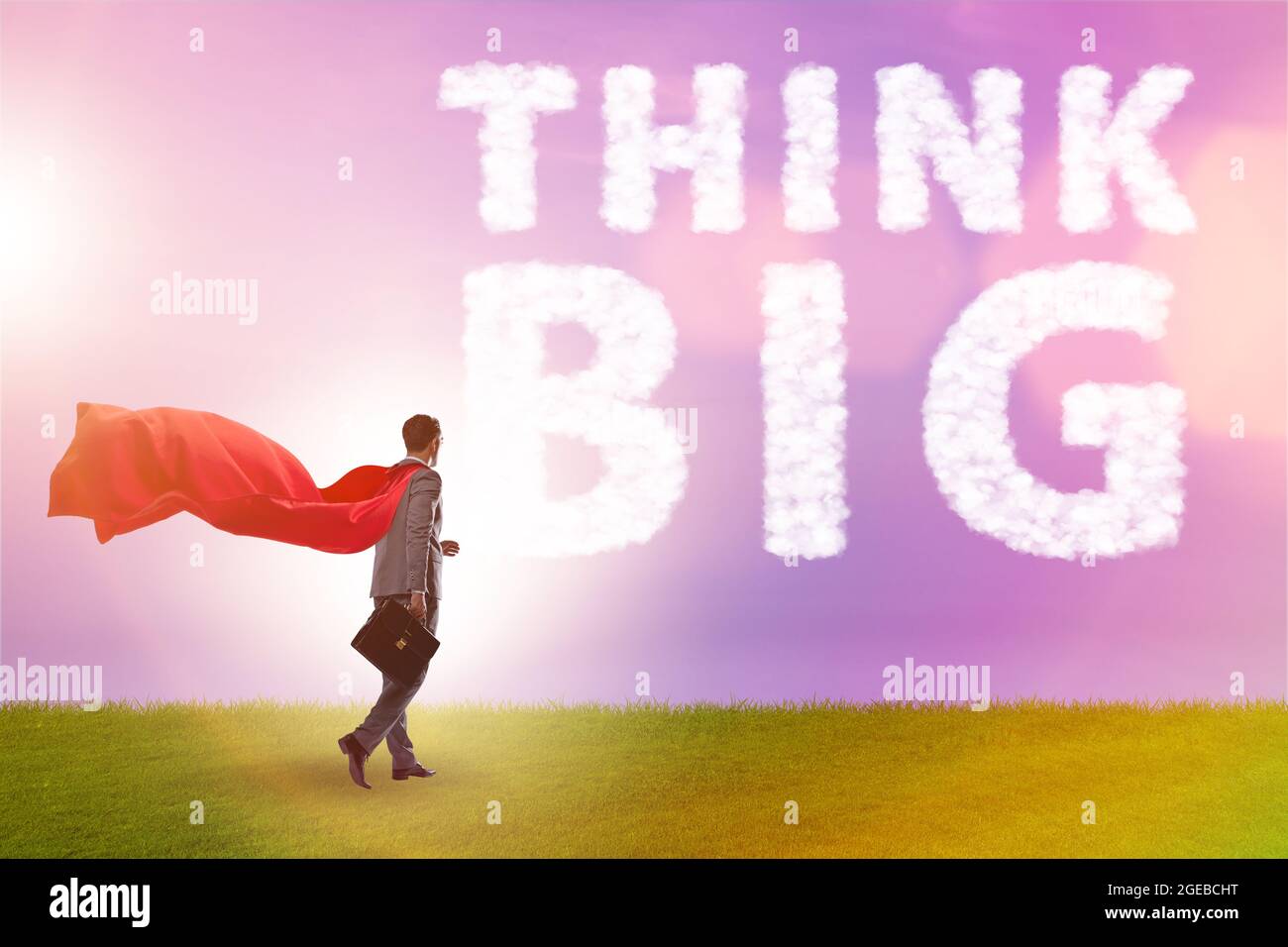 Think big concept with the businessman superhero Stock Photo - Alamy