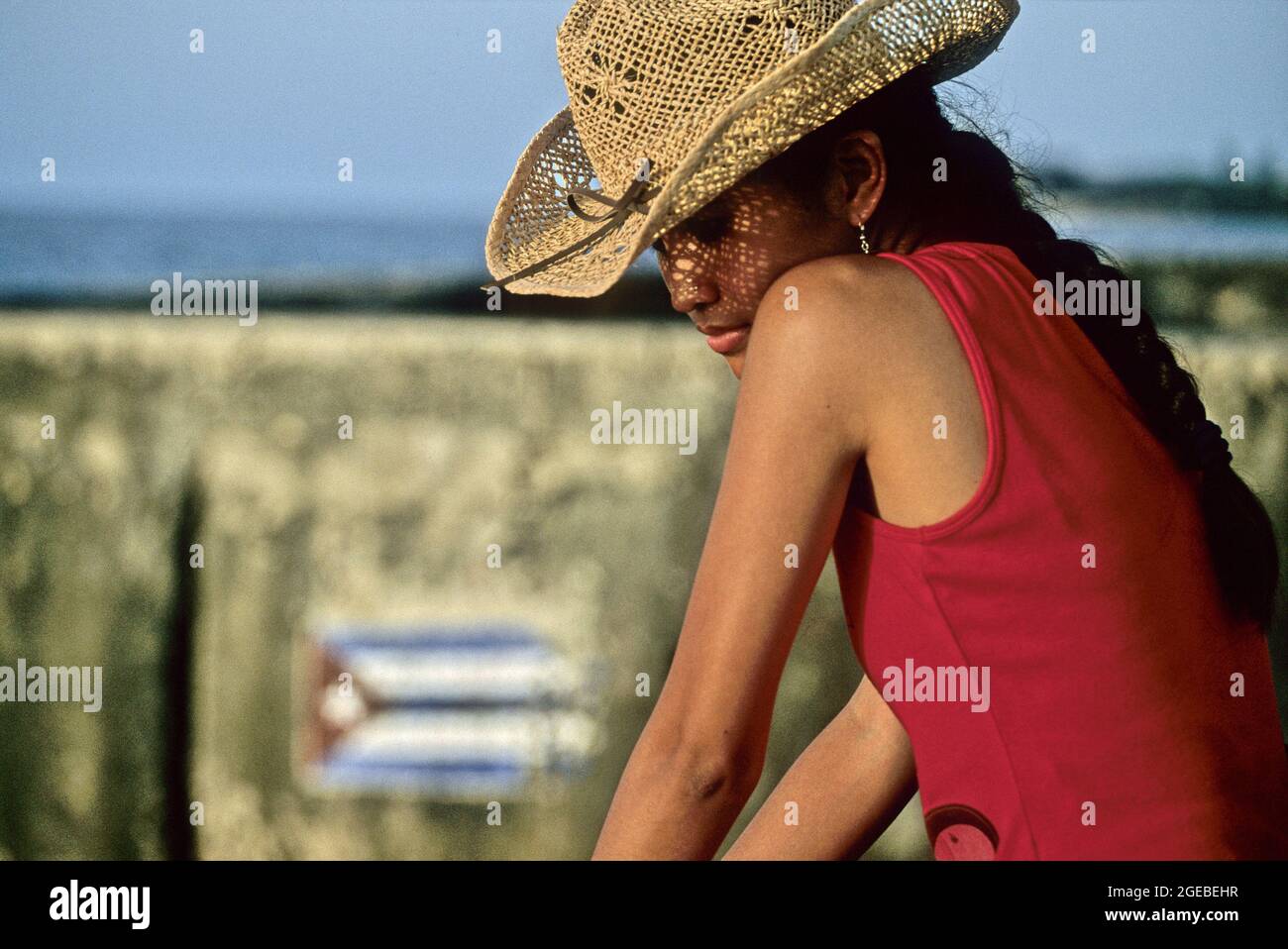 Girl watching the sunset from the Malecon, Havana, Cuba Stock Photo - Alamy