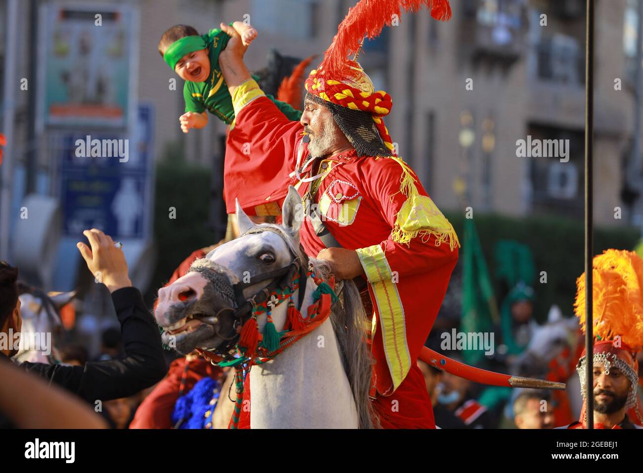 Karbala, Iraq. 18th Aug, 2021. An Iraqi Shiite Muslim takes part in the ...