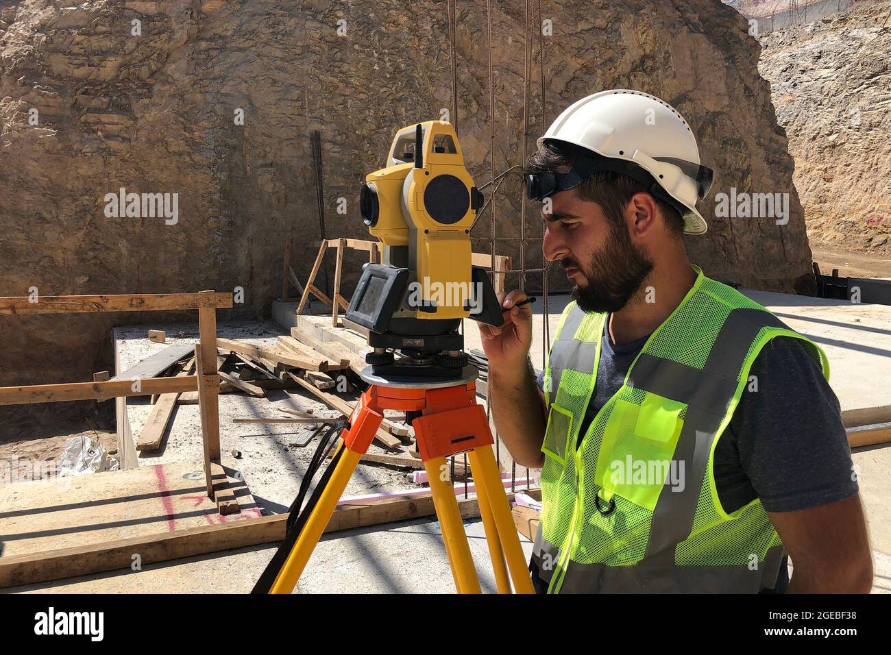 Land surveyor works at construction site Stock Photo - Alamy