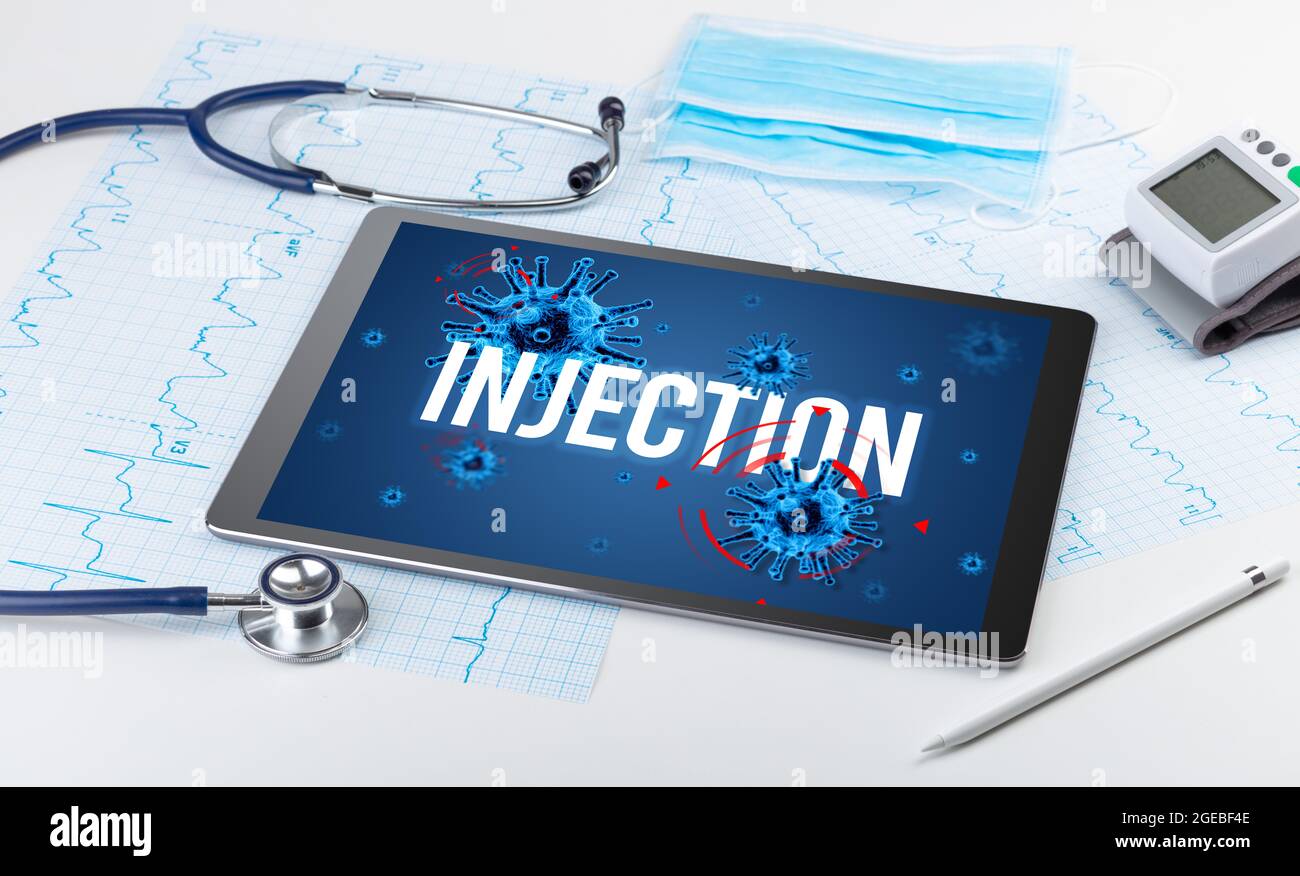 Tablet pc and doctor tools on white surface Stock Photo - Alamy