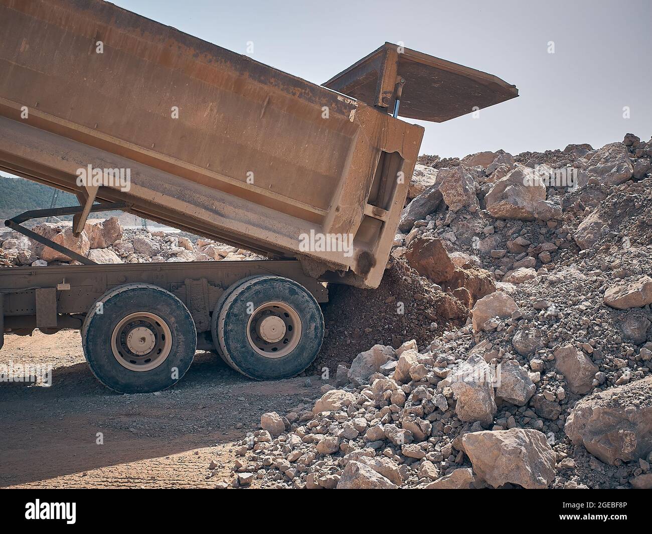 Dump truck unloads soil from truck back Stock Photo - Alamy