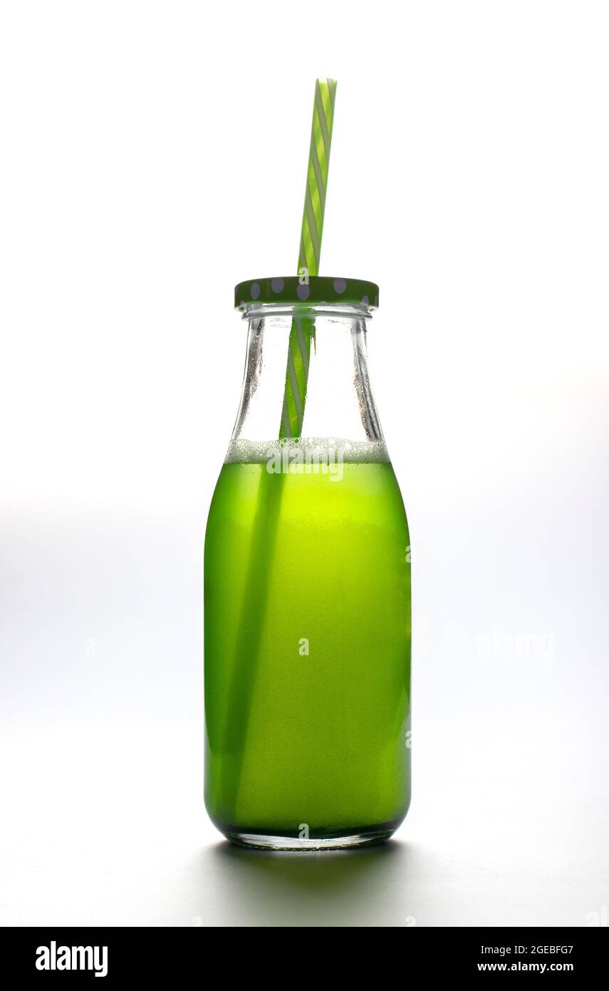 Chlorella organic algae dissolved in water in a transparent bottle with ...