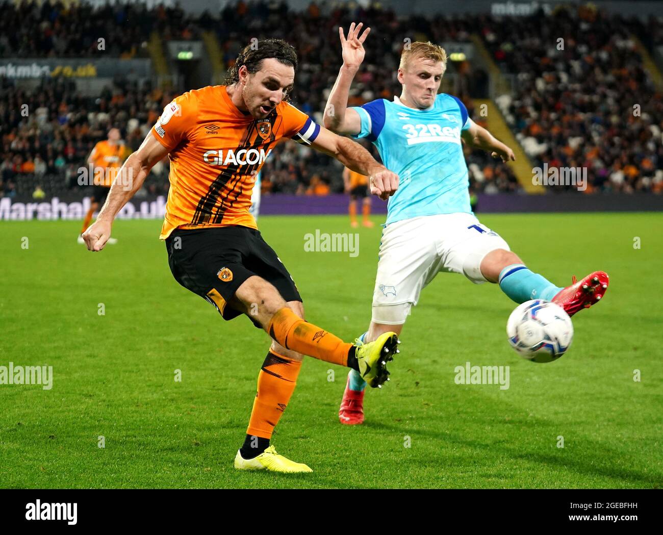 Hull City's Lewis Coyle (left) and Derby County's Louie Sibley battle ...