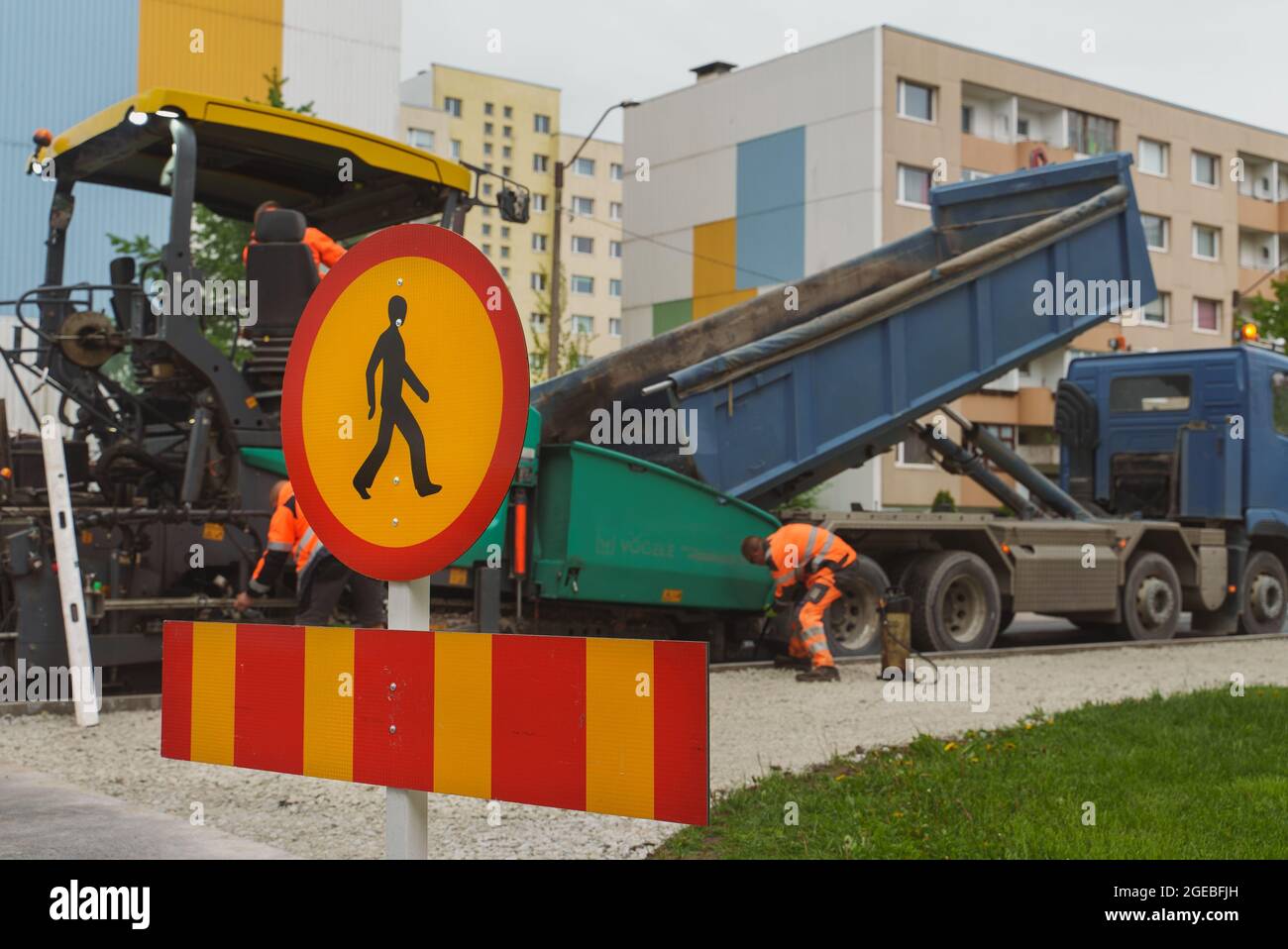 Road paving machine stacking asphalt on the street Stock Photo - Alamy