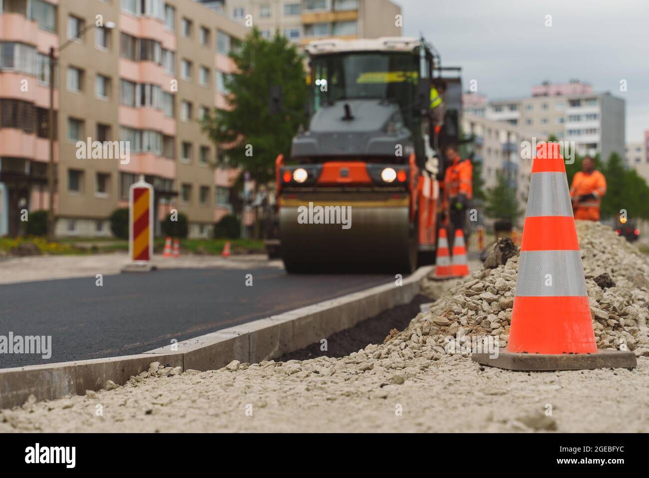 Road reconstruction. Heavy vibration road roller stacking hot asphalt ...