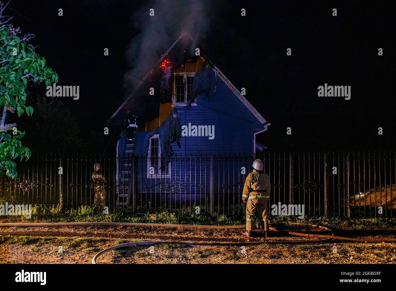 Man fire extinguisher in firefighting hi-res stock photography and ...